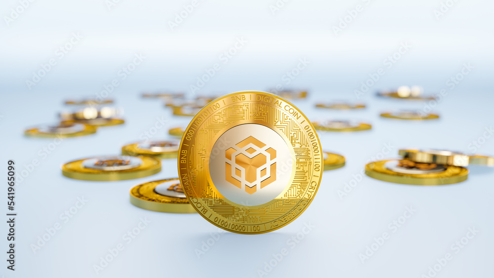 binance coins lying on the table, bnb cryptocurrency tokens with sign ...