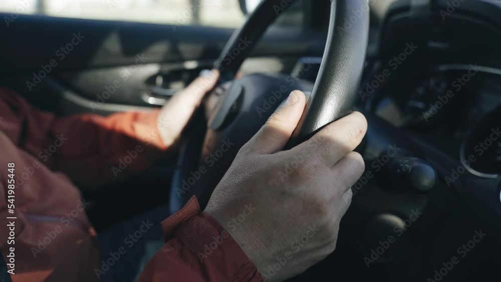The driver turns the steering wheel of the car. Close-up. Transport ...