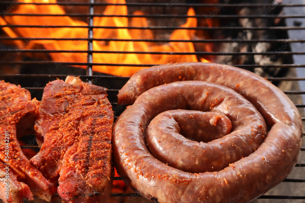 grilled sausages on grill. South African braai with boerewors Stock ...