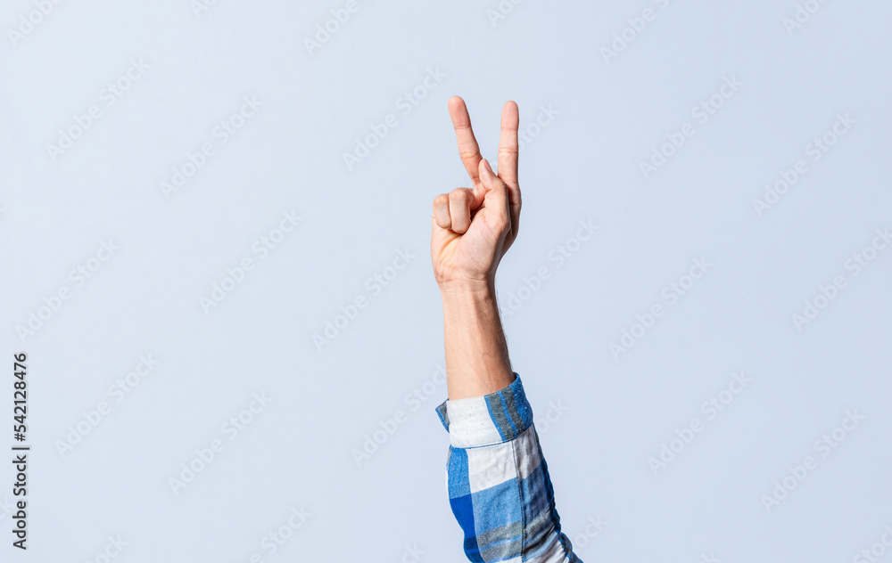 Hand gesturing the letter K in sign language on an isolated background ...