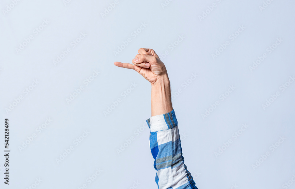 Hand Gesturing The Letter J In Sign Language On An Isolated Background hand-gesturing-the-letter-j-in-sign-language-on-an-isolated-background