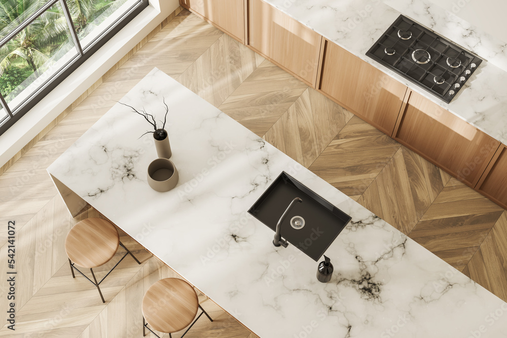 Top view of light kitchen interior with bar countertop, kitchenware and ...