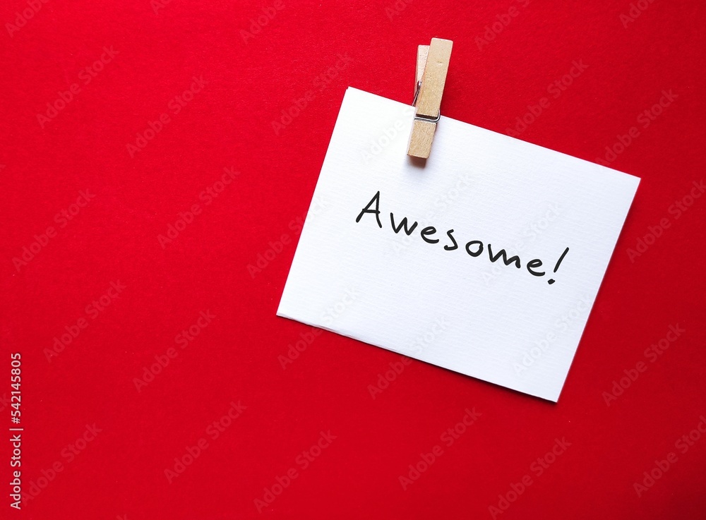 White note on copy space red background with handwritten text AWESOME ...