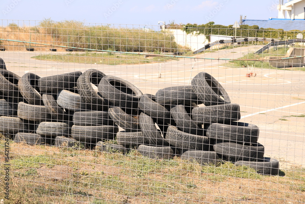 Pile of old car tires for rubber recycling. Waste tyres. Tires used on ...