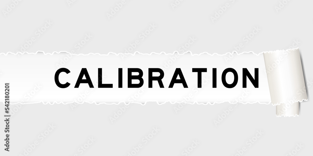 Ripped gray paper background that have word calibration under torn part ...