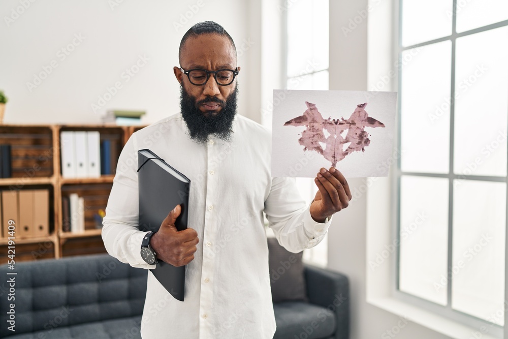 African american man working with rorschach test at psychology clinic ...