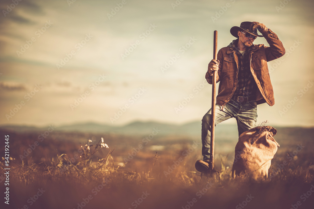 Cowboy with a Garden Fork in His Hand Staying in Front of His Farmland ...