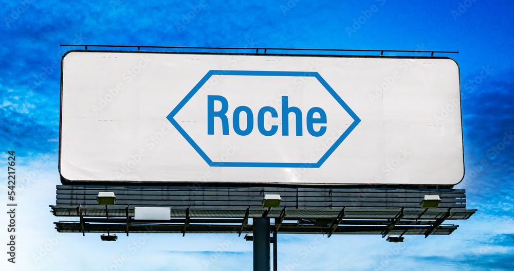 Advertisement billboard displaying logo of Roche Stock Photo | Adobe Stock