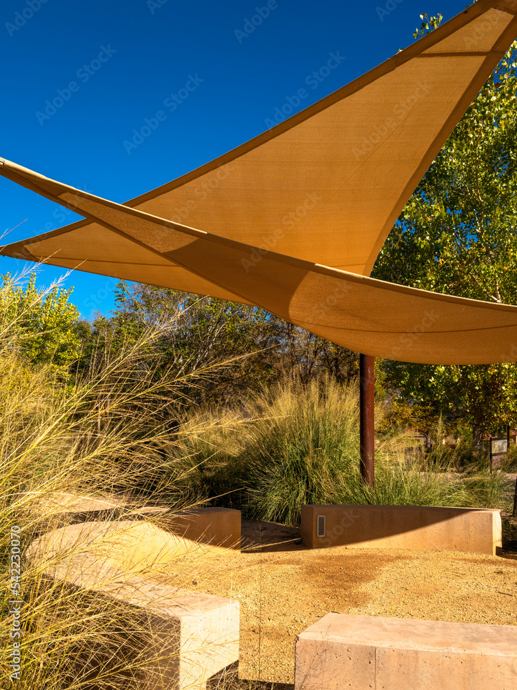 Triangle sun shade sail canopy in southwestern public city park Stock ...