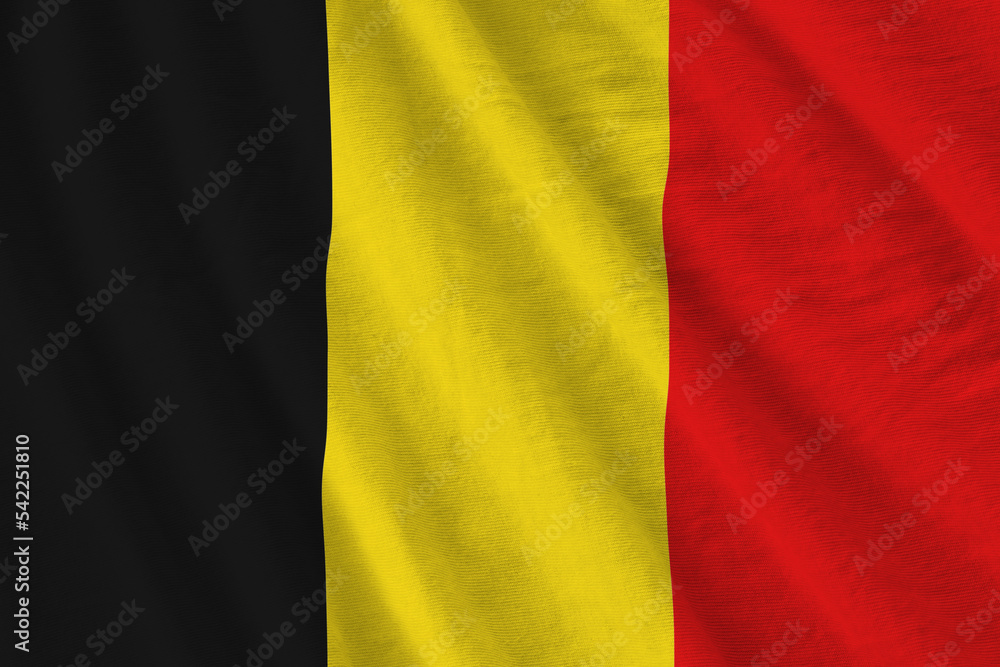 Belgium flag with big folds waving close up under the studio light ...