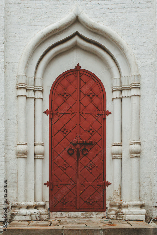 Old metal red door. Vintage iron doors. Big wrought iron door leafs ...
