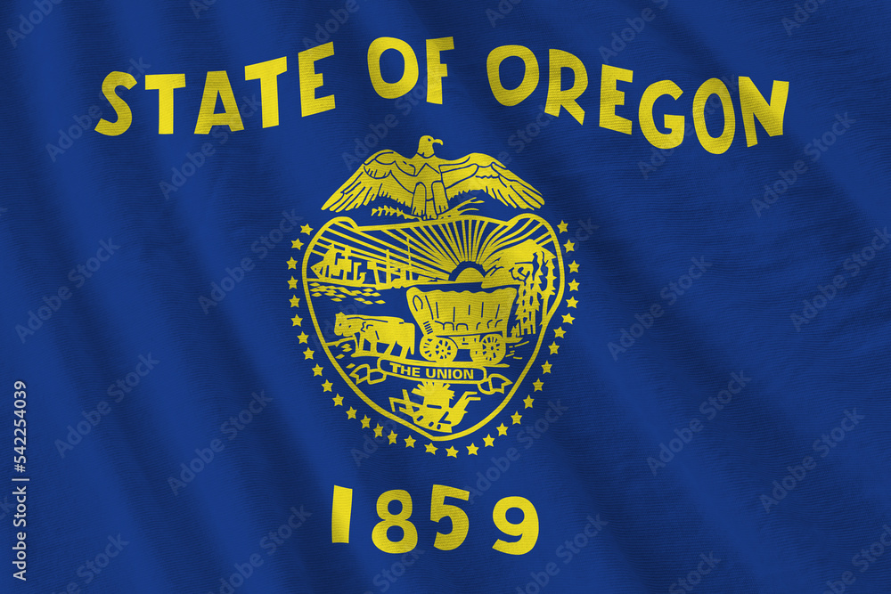 Oregon US state flag with big folds waving close up under the studio ...