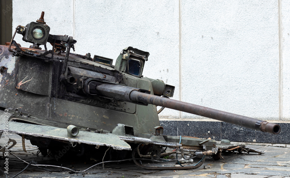War in Ukraine. Destroyed tank with a torn off turret with a V on it ...