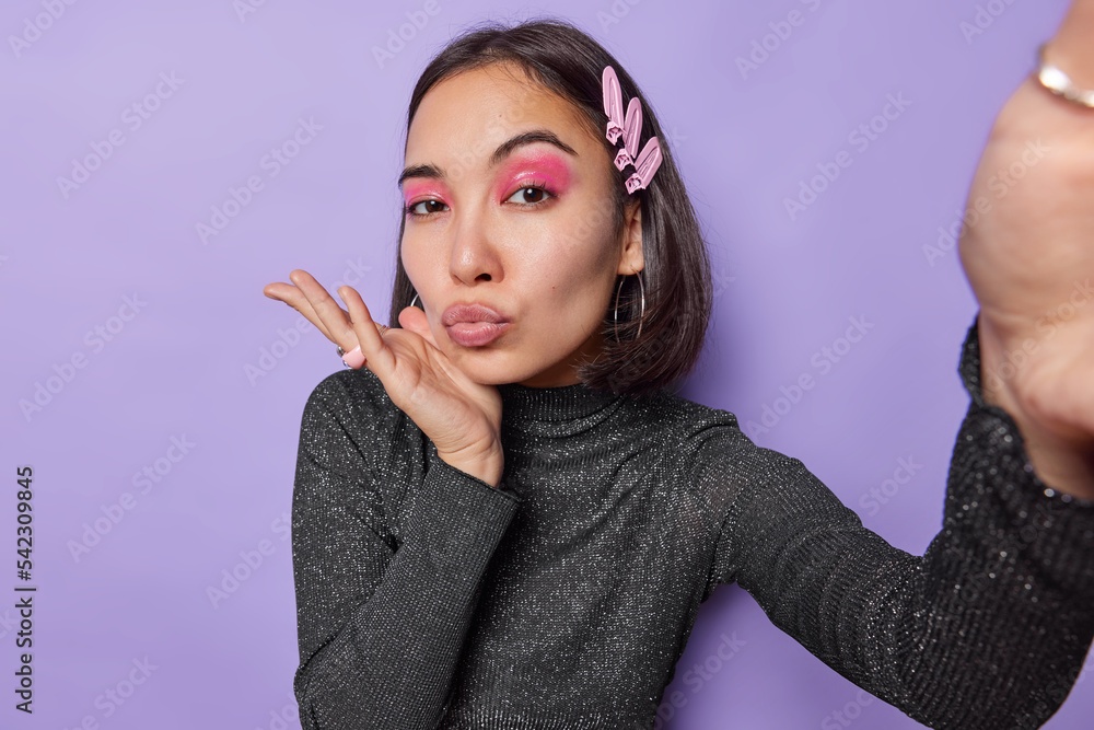 Lovely pretty young Asian woman with straight dark hair wears pink ...