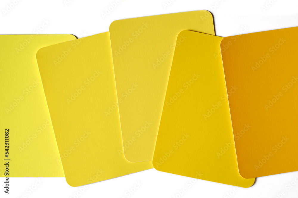 Generic color swatches scattered on a table. Various shades of yellow ...