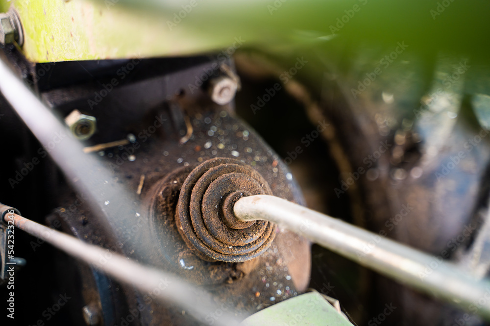 Gear lever on a walk-behind tractor close-up on a blurred background ...