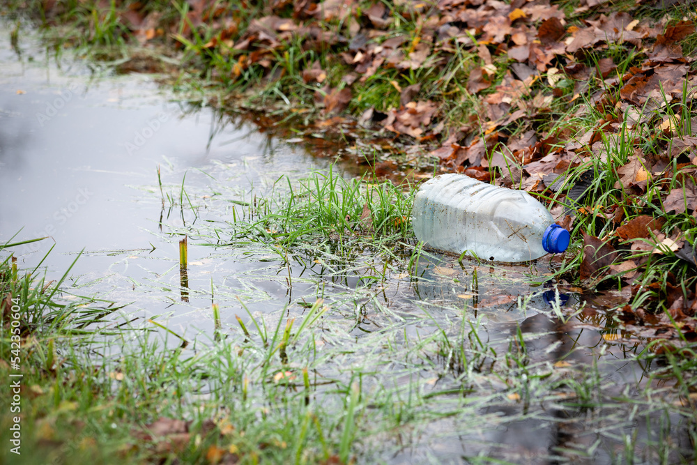 Plastic bottle in water. Waste collection and pollution of nature Stock ...