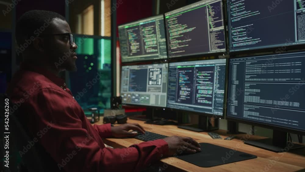 Stockvideon Black Cyber Security Specialist Coding on Desktop Computer ...