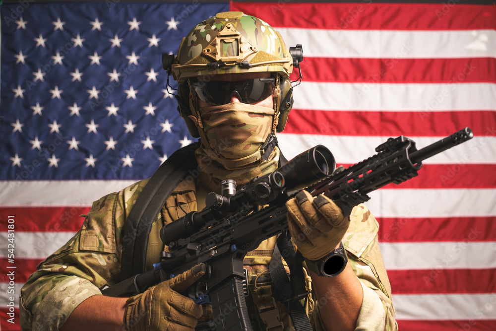 Army soldier in camouflage clothing holding riffle. Flag of United ...