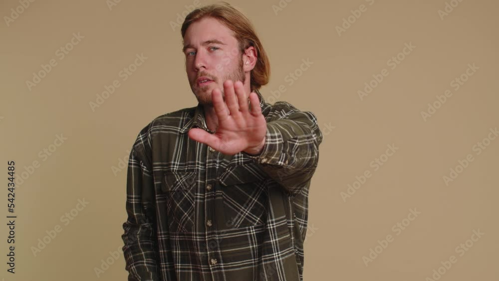 No stop. Serious adult man say No, hold palm folded crossed hands in ...