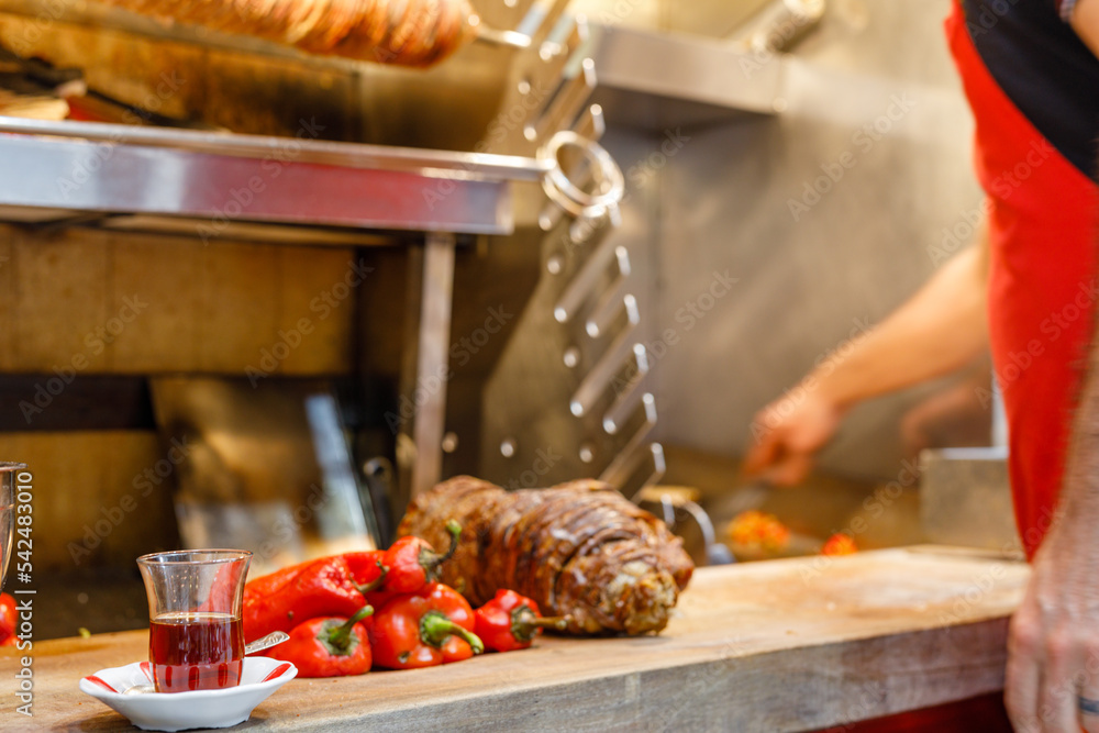 Chef cutting with doner knife Traditional Turkish Doner Kebab meat ...