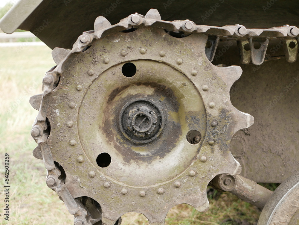 Metal tracks on a tank from the Second World War. Rubberized wheels of ...