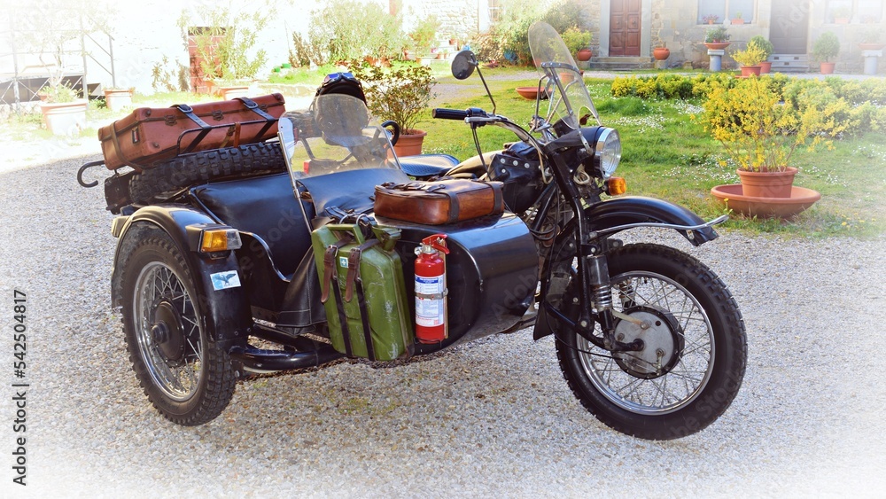 vintage IMZ-Ural motorcycle with sidecar produced by the Russian ...