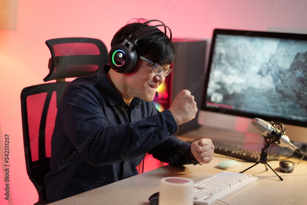 Professional Gamer Playing First-Person Shooter Online Video Game on ...