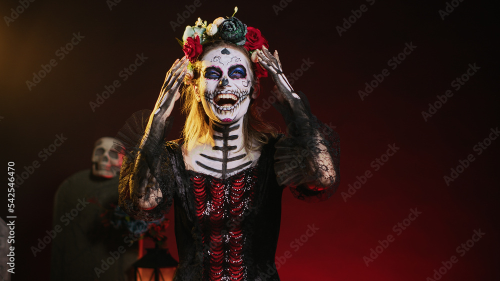 Scary dead woman screaming loud dressed in costume with skull body art ...