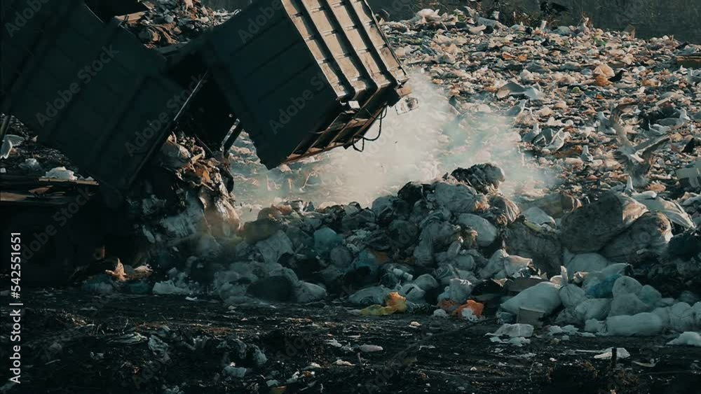 Garbage truck unloads city waste. Unsorted trash footage. Pollution of ...