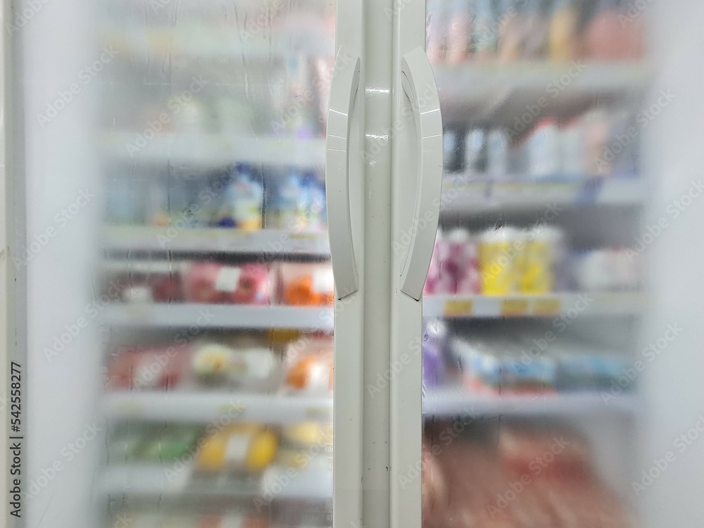 Soda pop and soft drinks in the Fridge. Glass door refrigerator ...