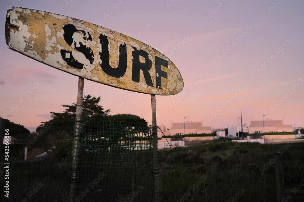 old and deteriorated surf sign made from an old surfboard Stock Photo ...