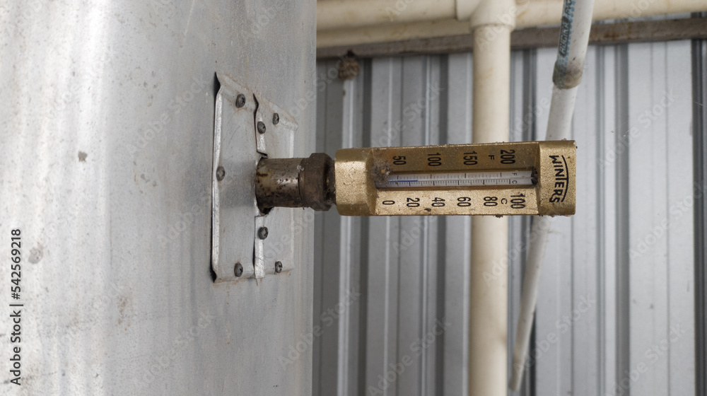Gold thermometer instaled to boiler tank for measurment heat ...