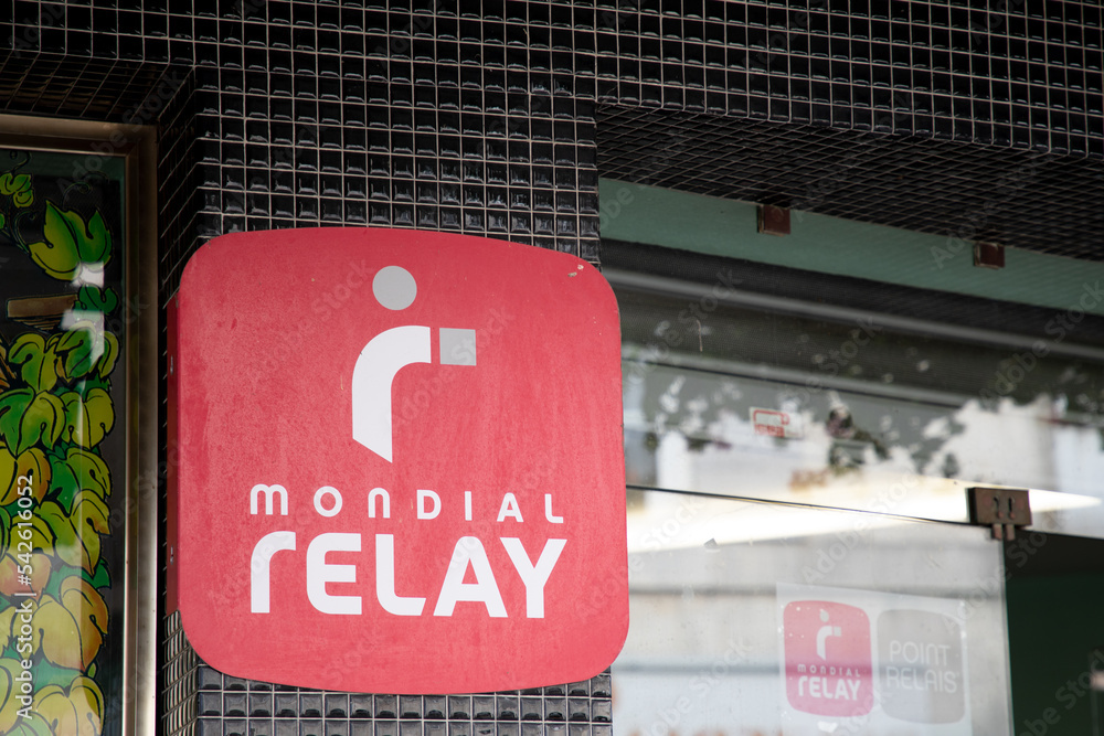 Mondial Relay delivery red shop sign text and brand logo on boutique ...