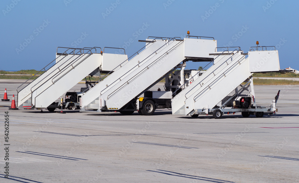 Passenger ladders or boarding ramps on airfield, no people. Mobile ...