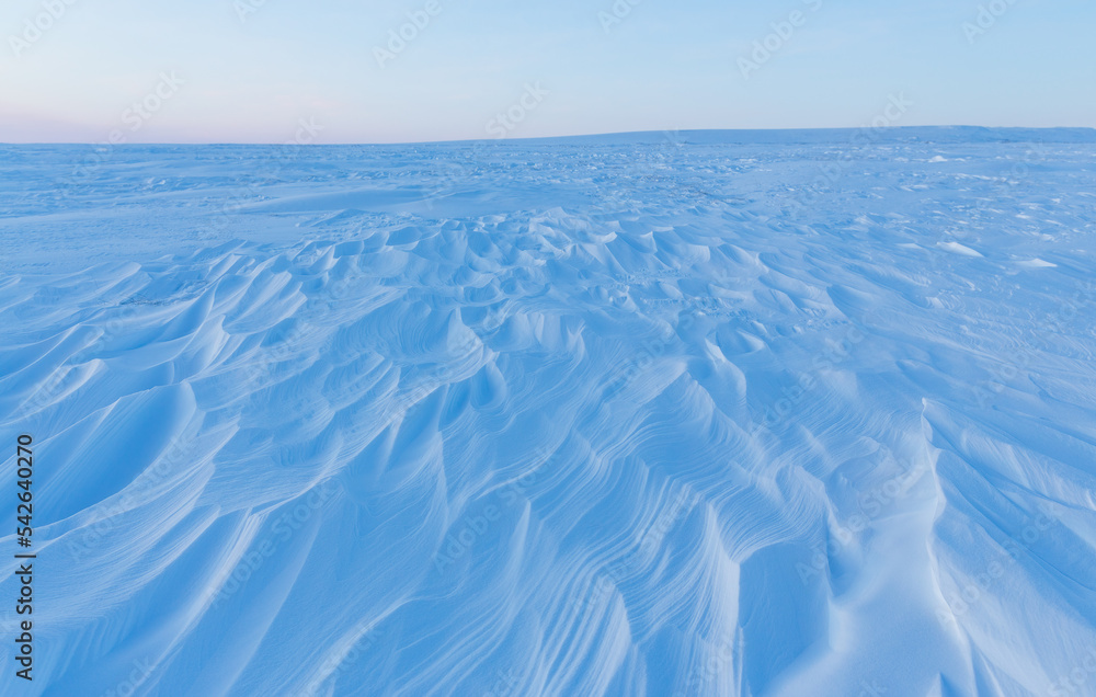 Winter arctic landscape. Snow-covered tundra. On the surface of the ...