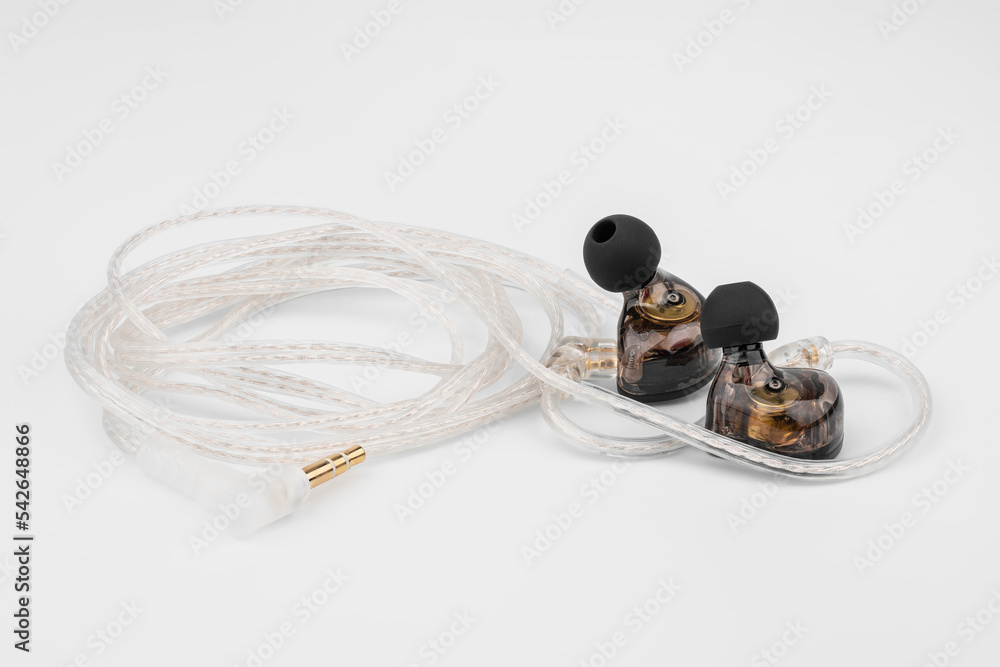 In ear monitor on a tablature background. Custom in-ear monitors with ...