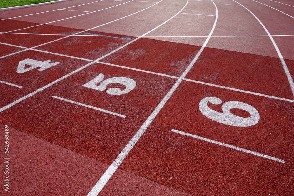 Athletics track surface. Running track with lane markings and numbers ...
