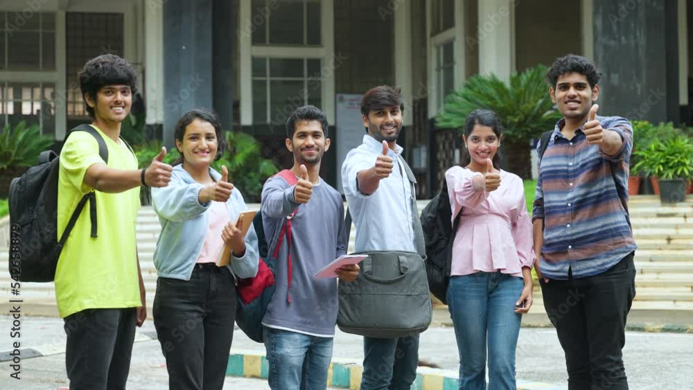 group of Confident students with backpack and books showing thumbs up ...