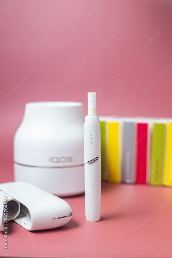 IQOS 3 duo white. Sticks in packs for smoking Stock Photo | Adobe Stock