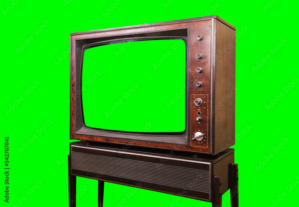 Old vintage TV with green screen isolated on green background. Side ...