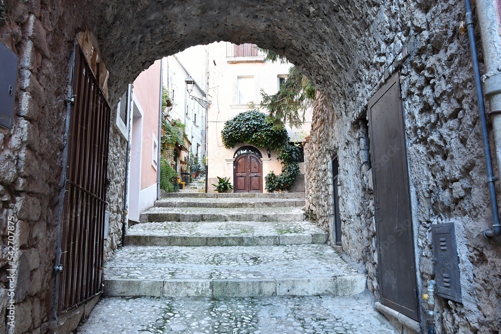 A small street between ancient buildings in Atina, a historic town in ...