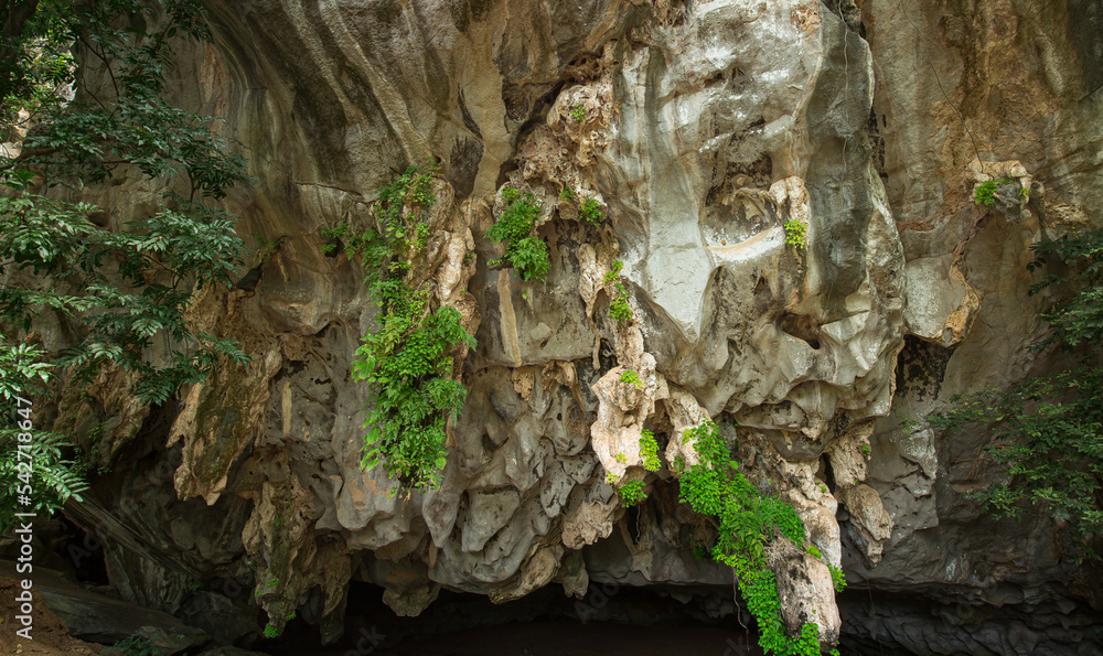 Entrance to a cave in the mountains. Cave in mountain rocks. Mountain ...