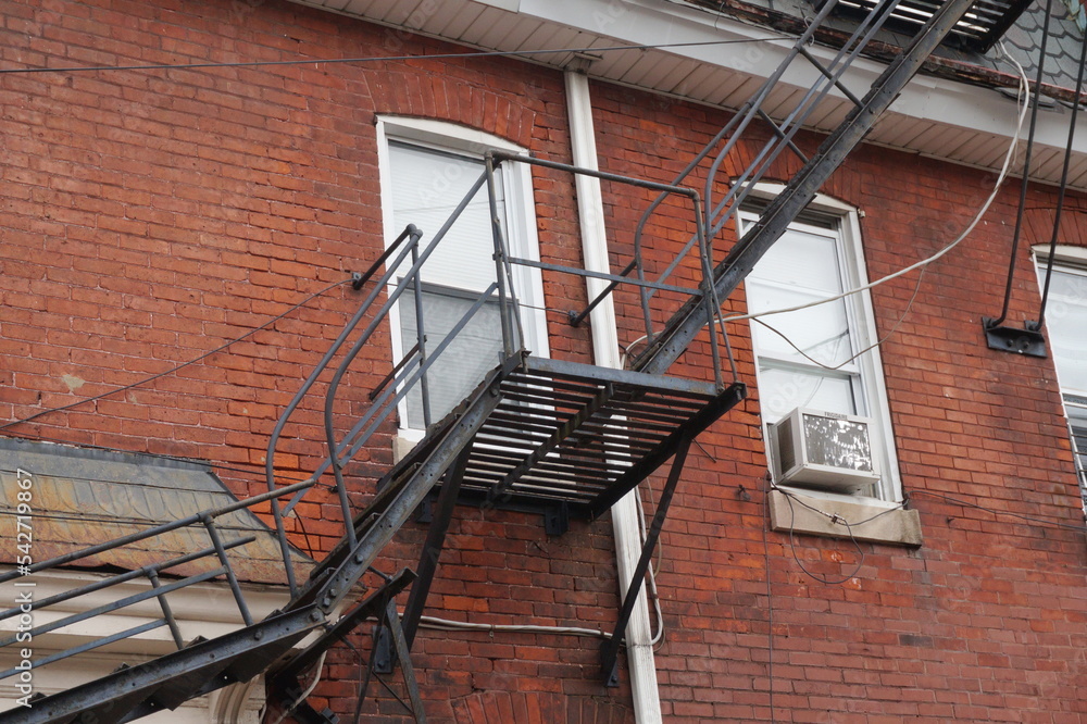 Black Wrought Iron Fire Escape on Red Brick Building with WIndows Stock ...