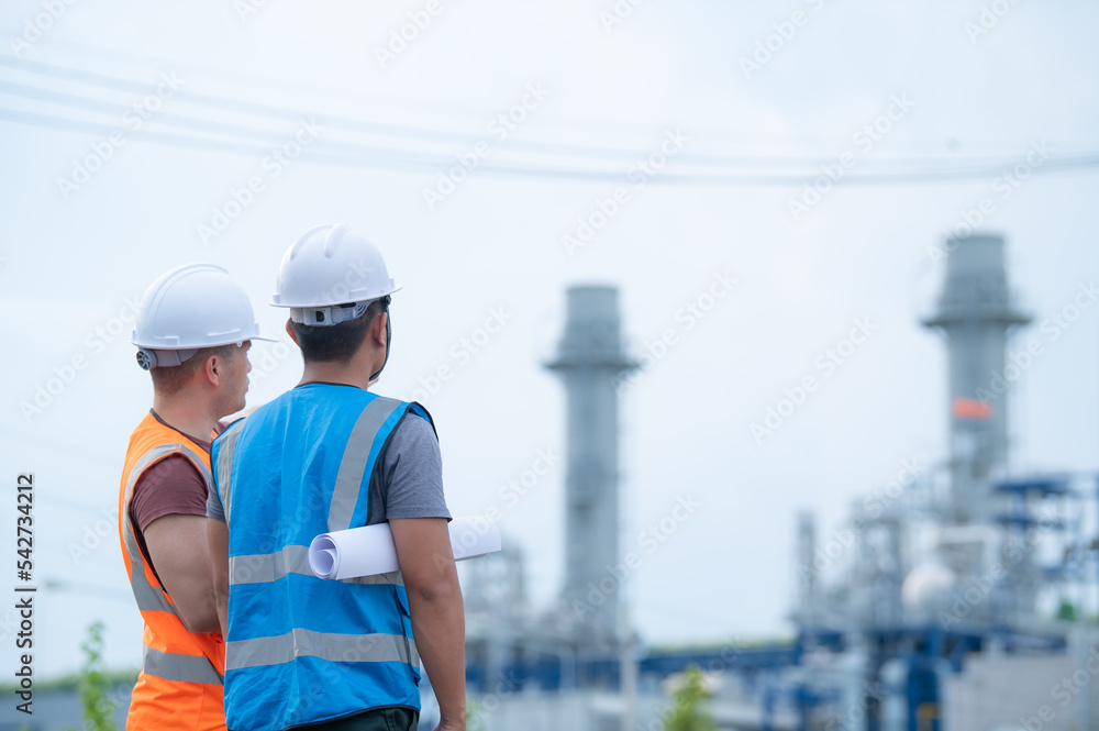 Two engineer working at power plant,Work together happily,Help each ...