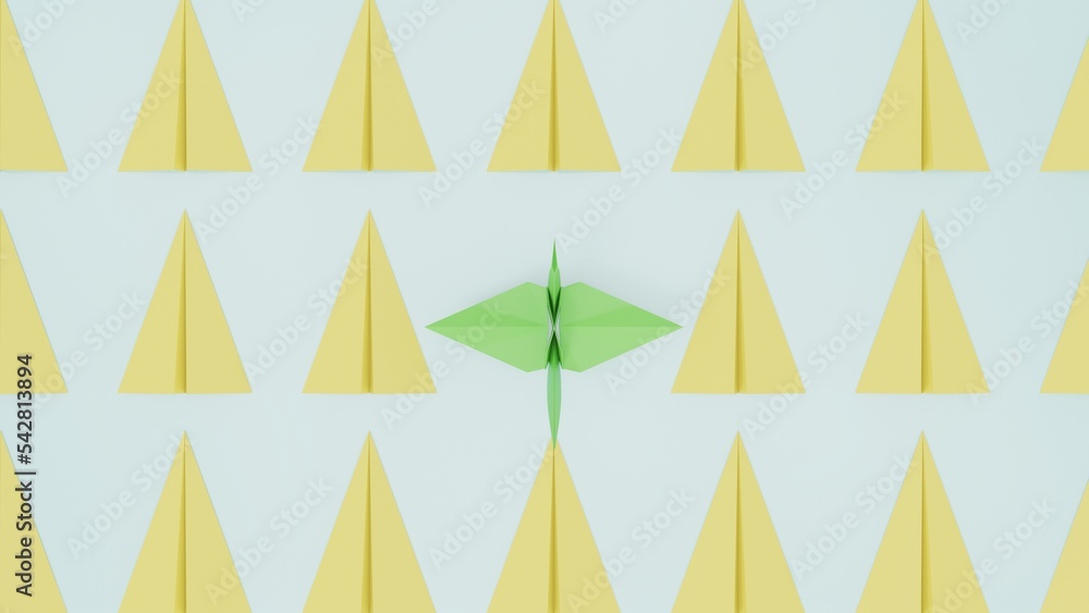 Origami of lime green crane and many soft yellow airplanes on green ...