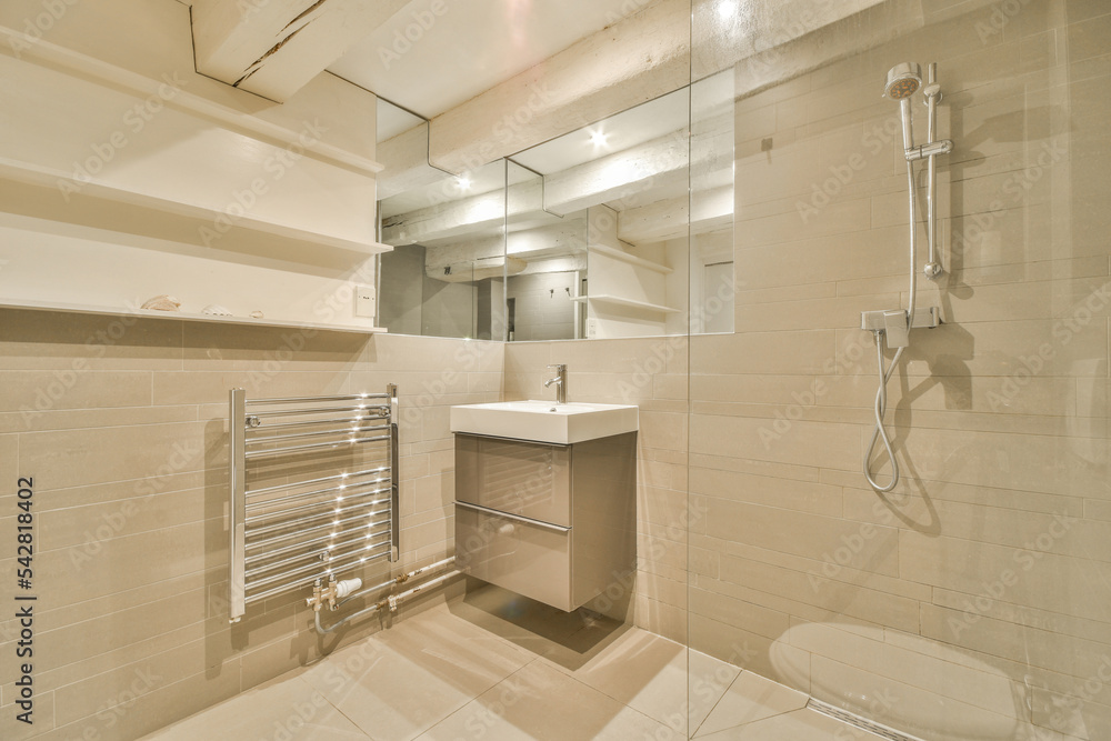 Glass partition between shower tap and wall hung toilet in modern ...