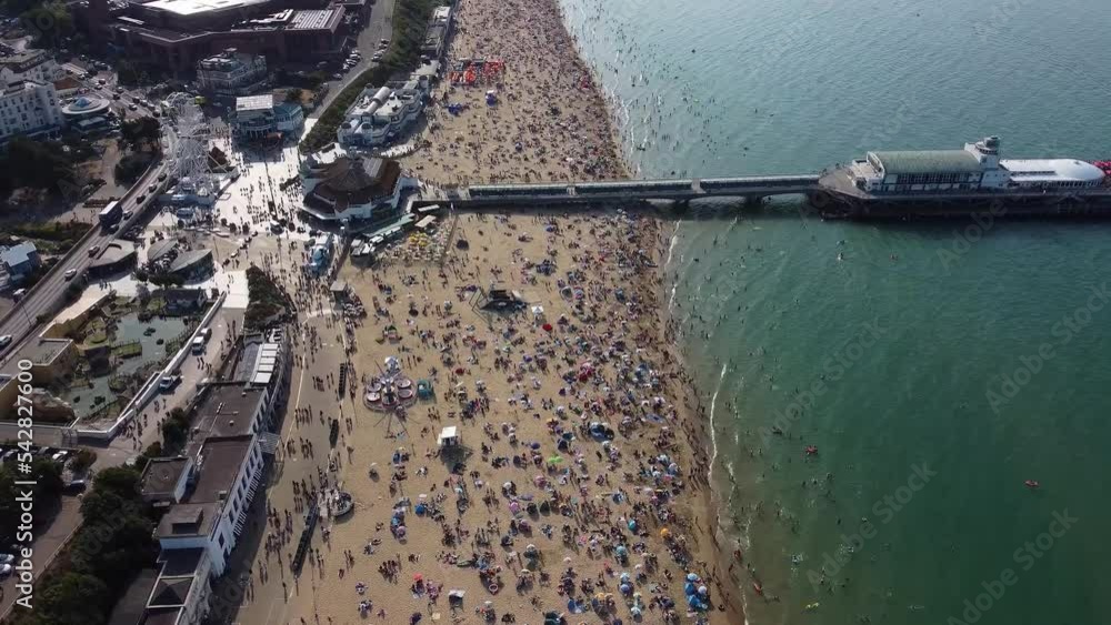 Aerial Footage of British Sandy Beach and Ocean with People on Their ...
