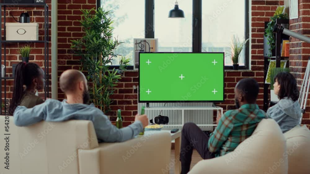 Diverse friends watching tv series on greenscreen template, using ...