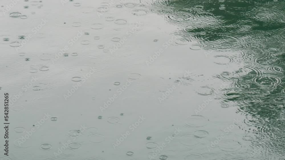 Rain Dropping on Blue sea water. Rainy Season in Tropical Countries ...